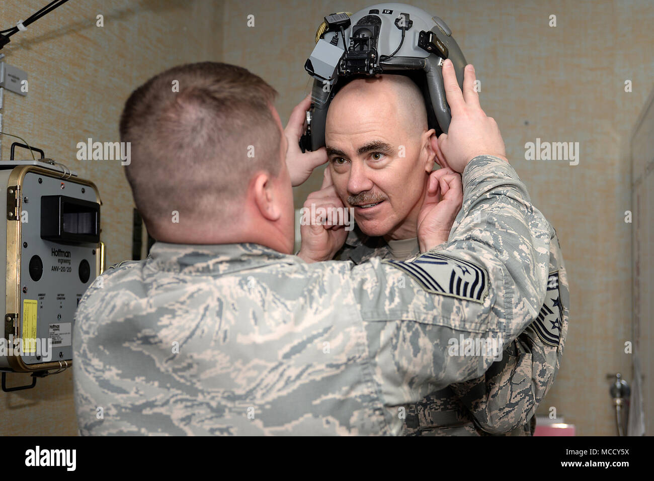 U.S. Air Force Chief Master Sgt. Jason L. Gioconda places a Helmet ...