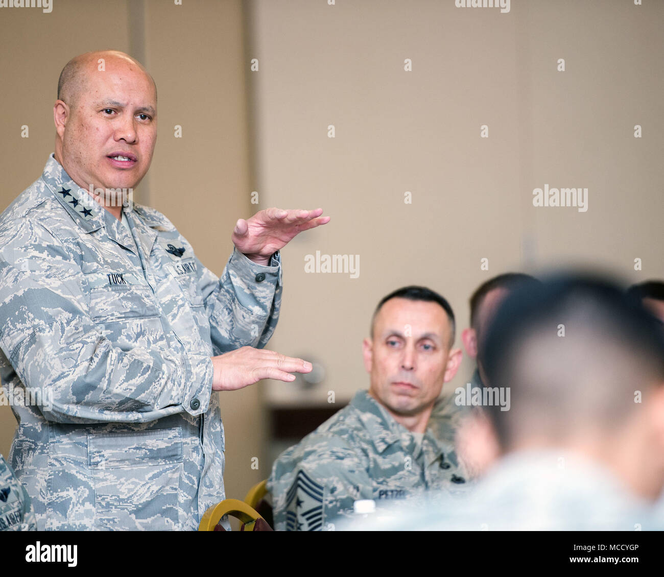 U.S. Air Force Lt. Gen. GI Tuck, 18th Air Force commander, speaks with ...