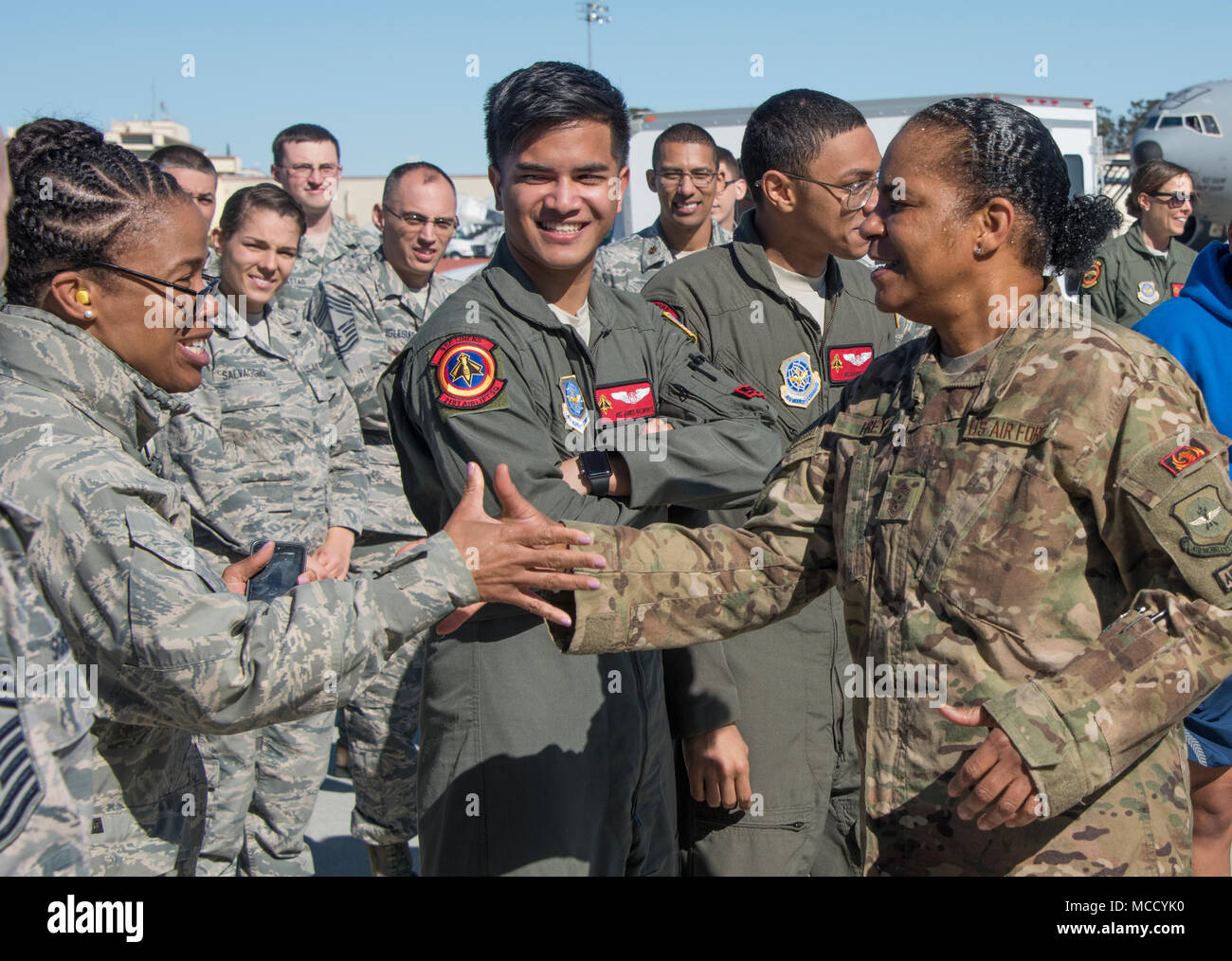 Airmen greet Chief Master Sgt. Shelina Frey, the command chief master ...