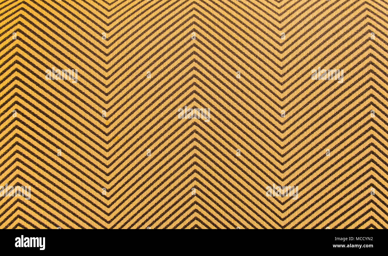background texture-full frame close up of brown and gold zig zag ...