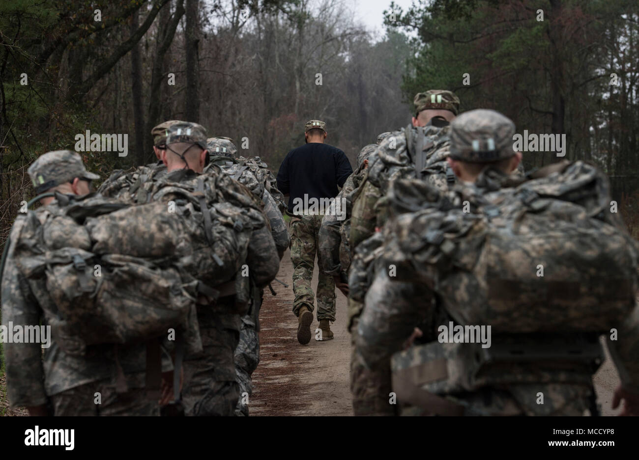 Airmen follow a Ranger during a Pre Ranger Assessment Course, Feb. 10 ...