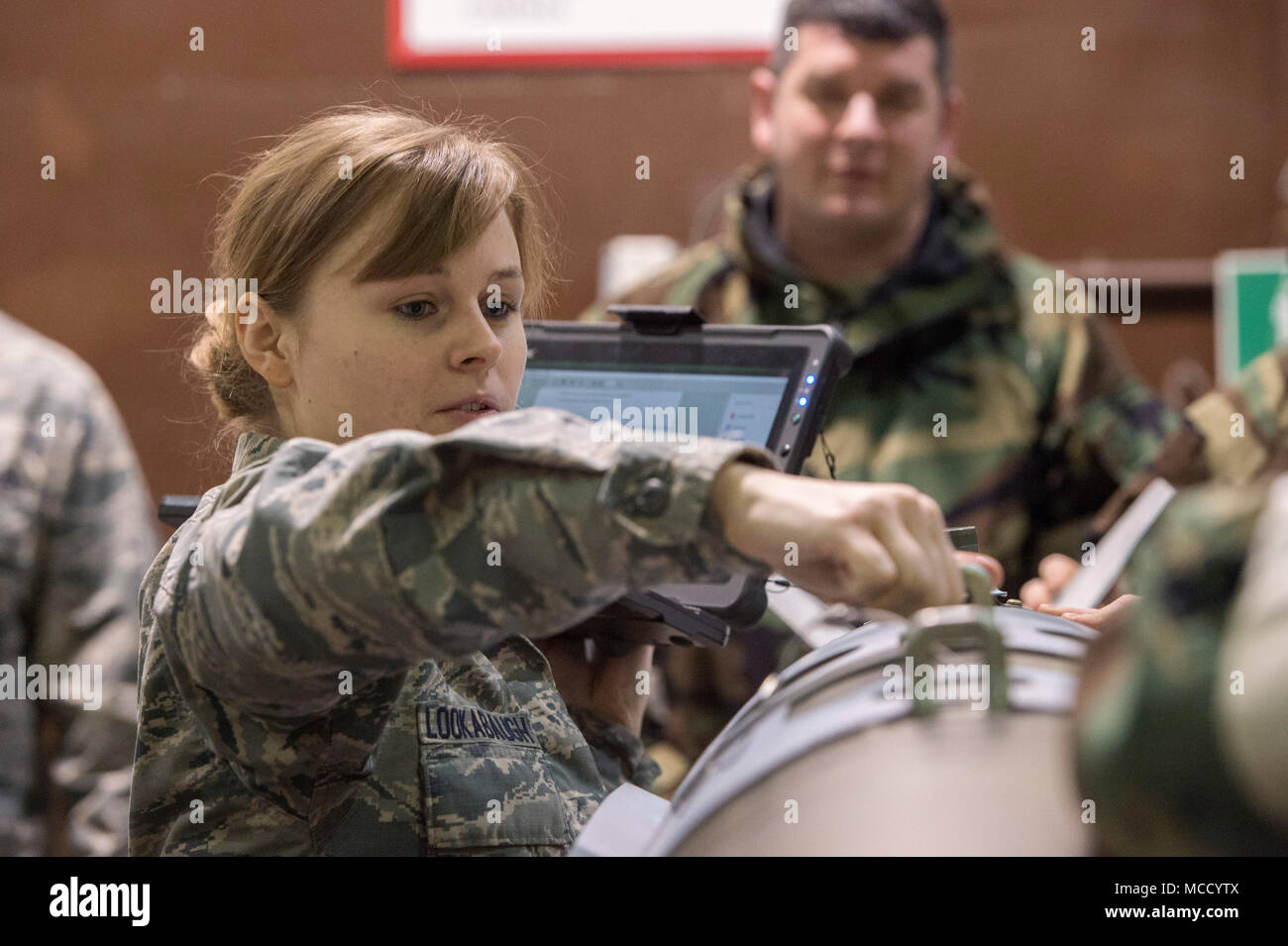 Air Force Staff Sgt. Kristin Lookabaugh, a munitions crew chief with ...