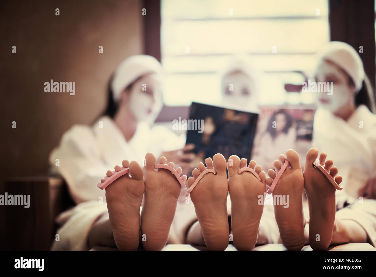 bachelorette party in spa, girls with face mask reading magazine ...