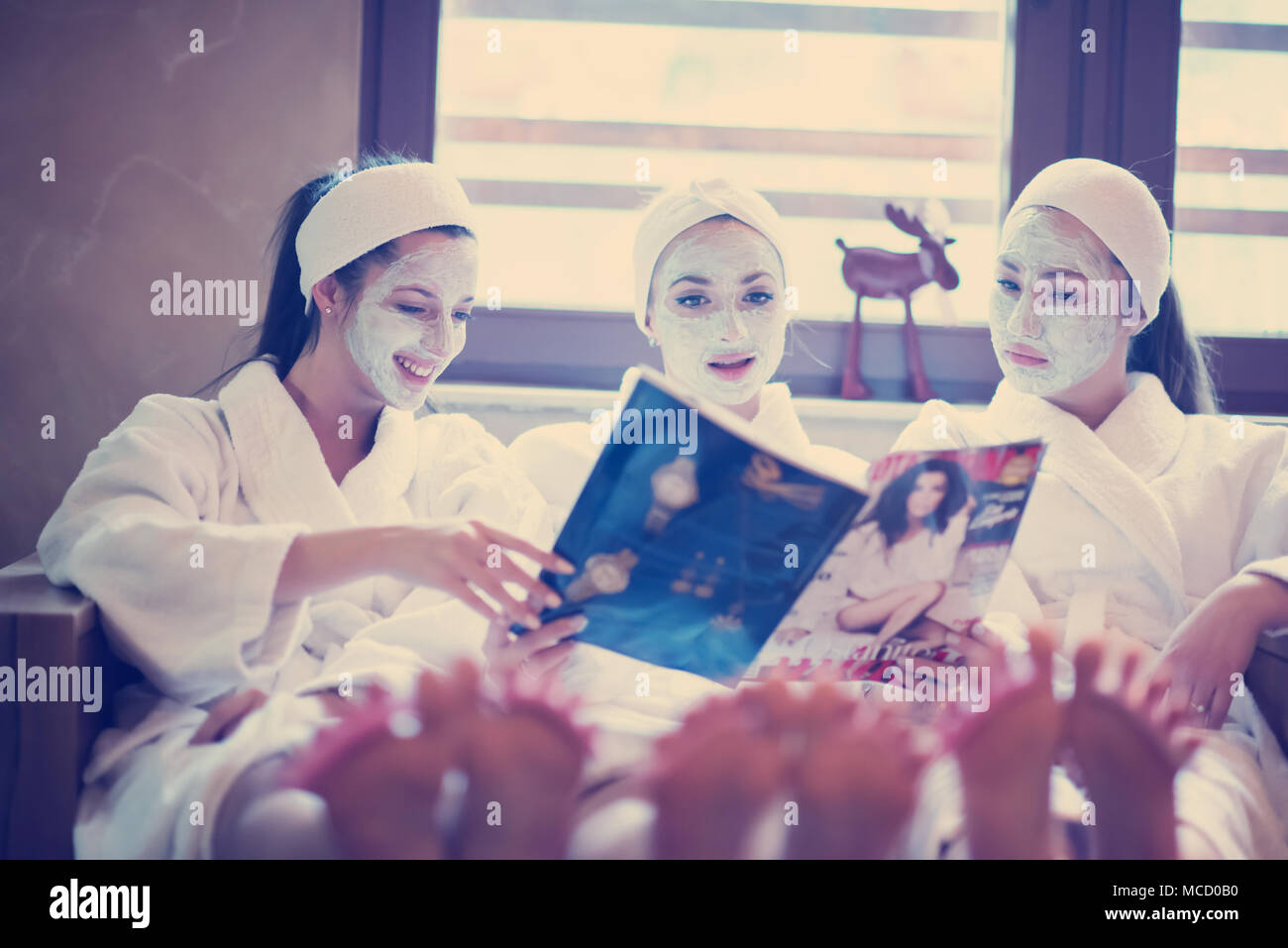 bachelorette party in spa, girls with face mask reading magazine ...