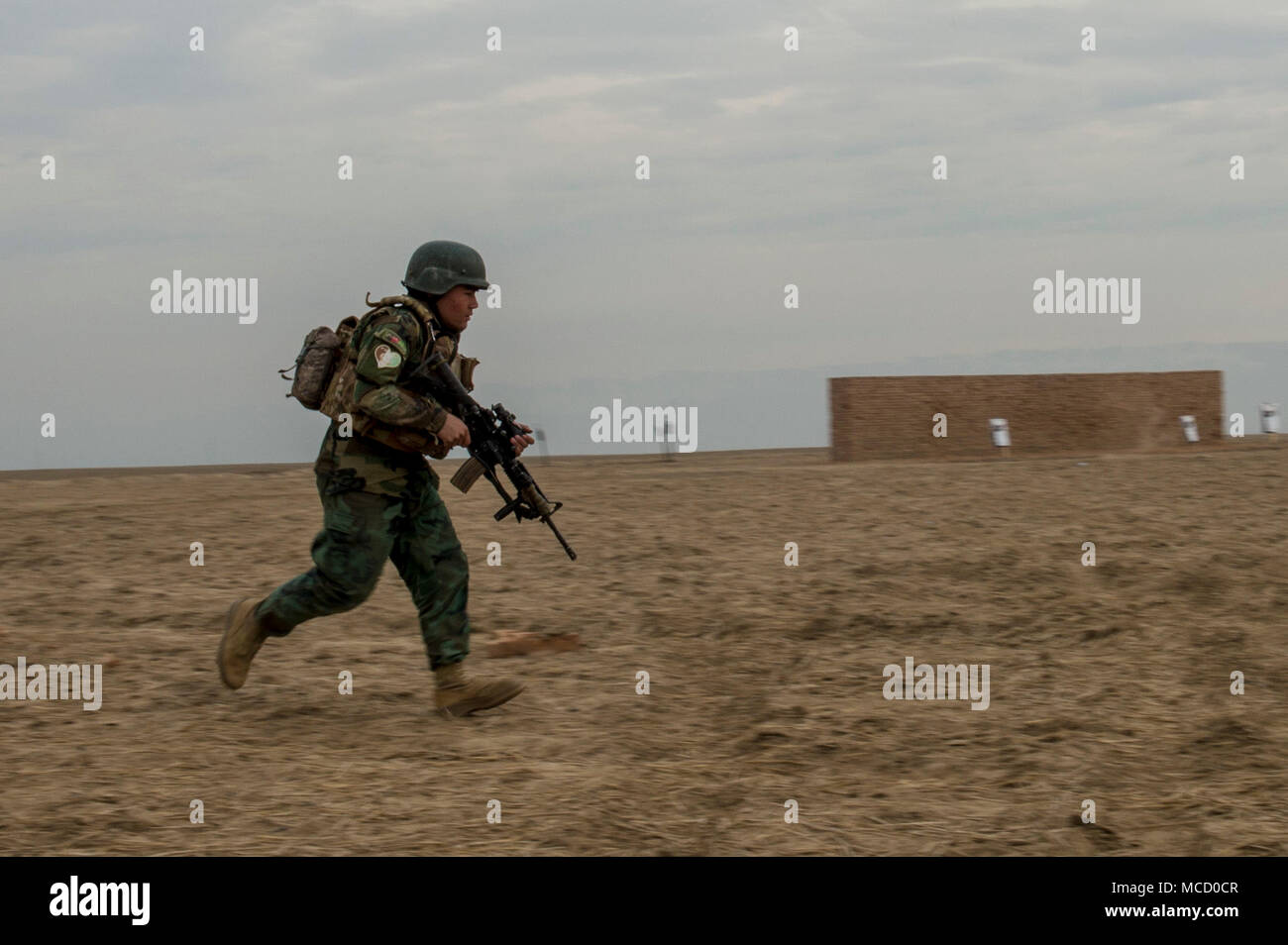 An Afghan National Army Commando races to the objective during training ...