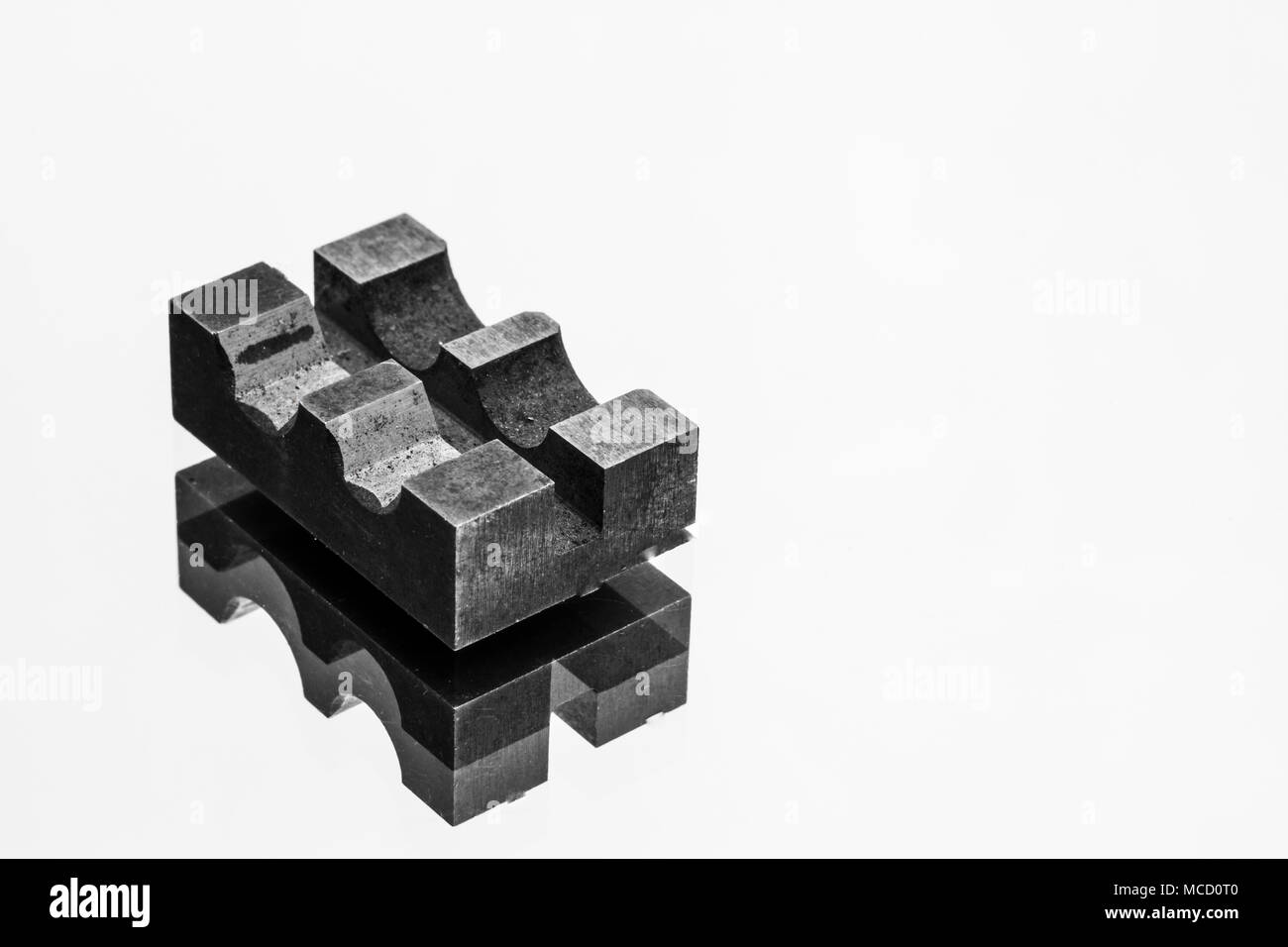 Close up view of manufactured metallic object showing fine details on ...