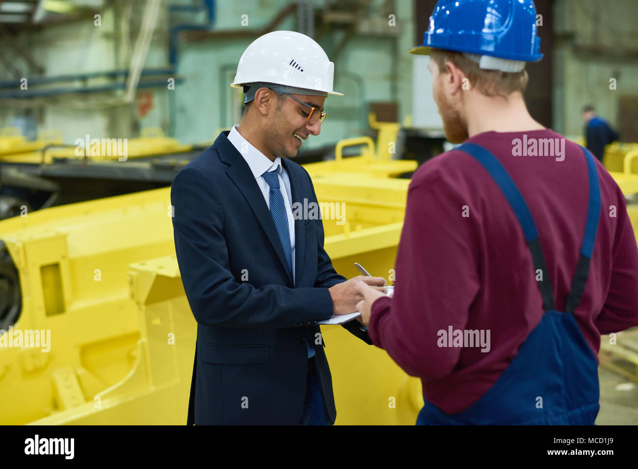 Giving Explanations to Inspector Stock Photo - Alamy