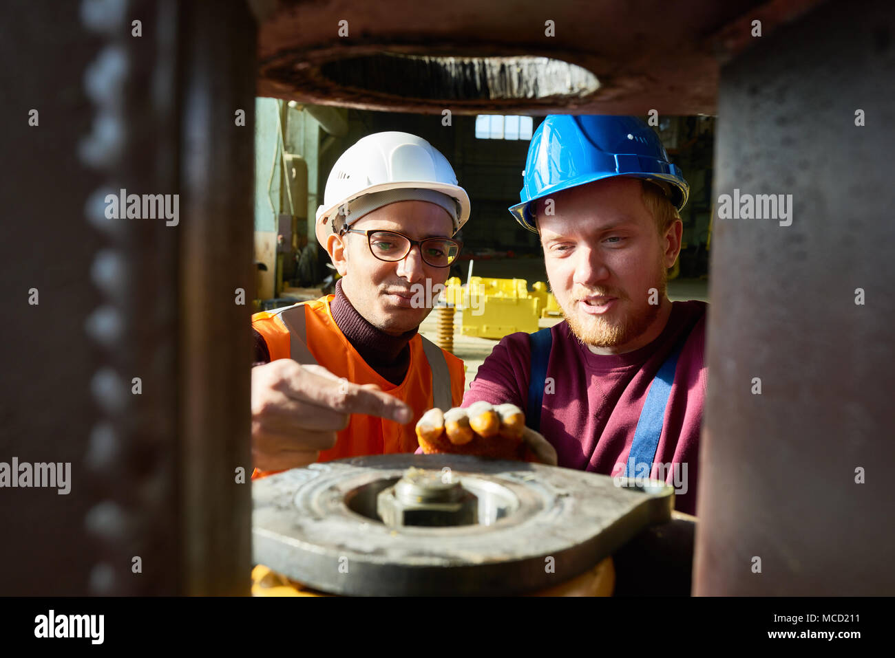 Making Adjustments to Machine Stock Photo - Alamy