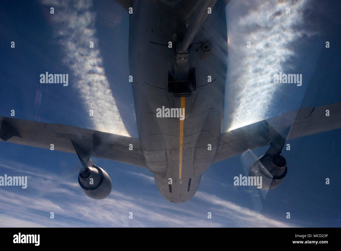 Contrails peel away from a U.S. Air Force KC-10 Extender crewed by ...
