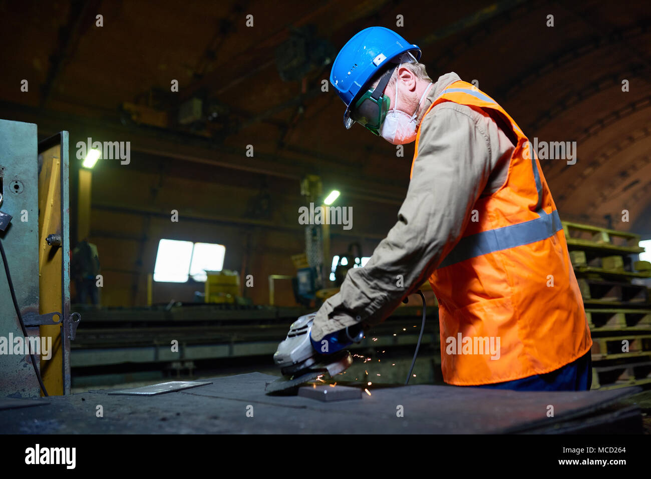 Highly Professional Worker Using Angle Grinder Stock Photo - Alamy