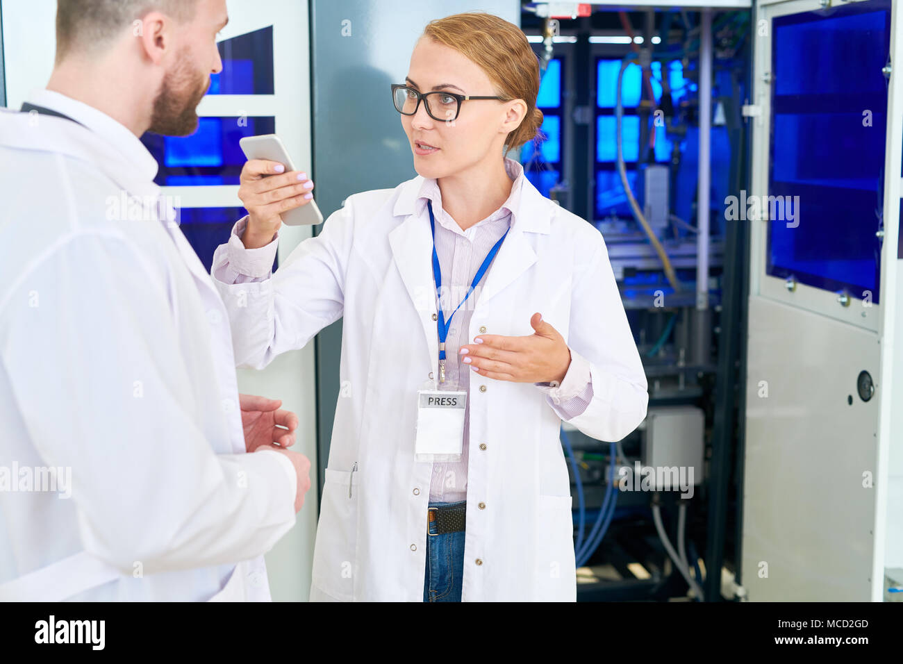 Journalist Asking Questions at Modern Plant Stock Photo - Alamy