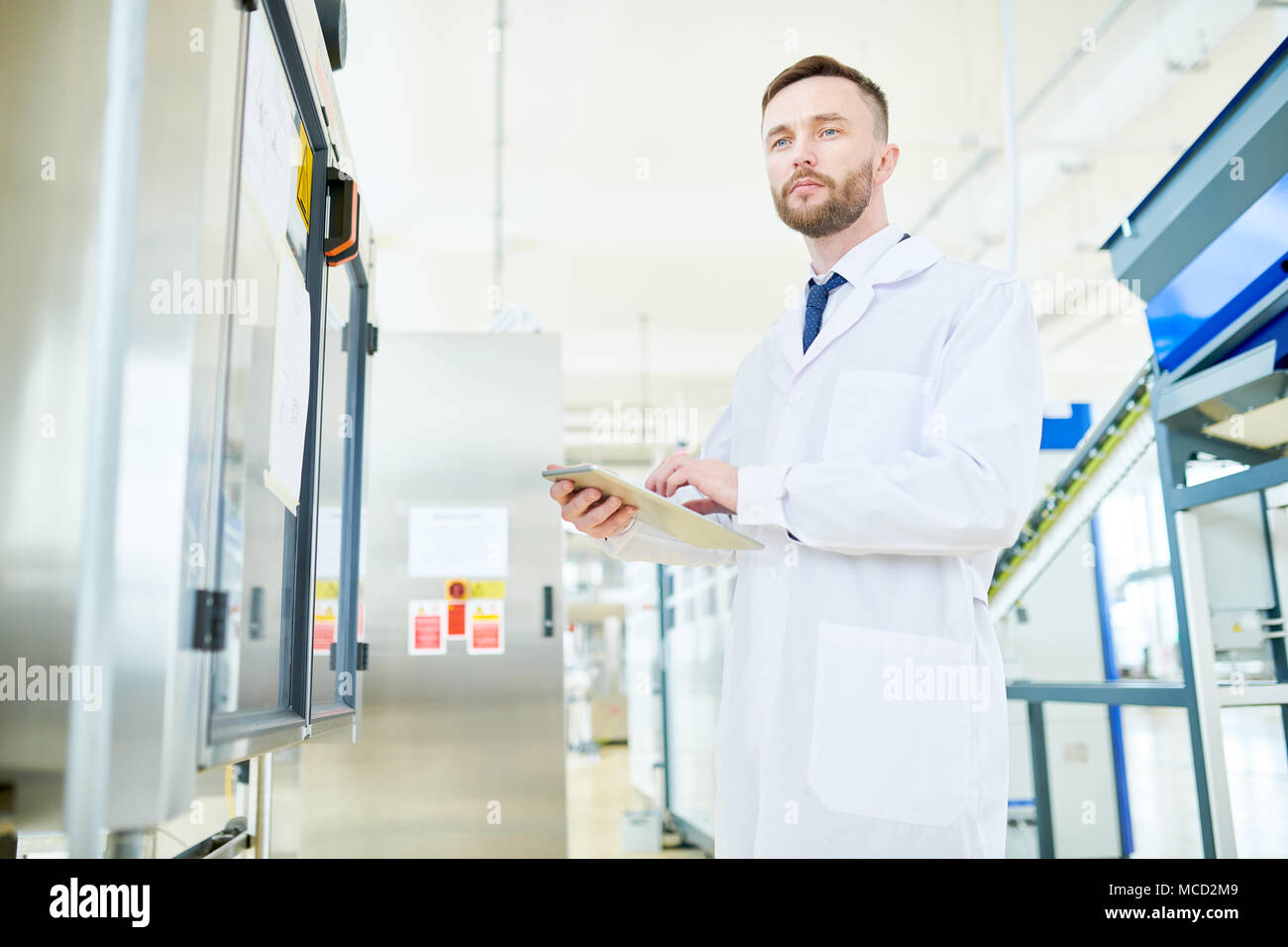 Operating Machine at Modern Factory Stock Photo - Alamy