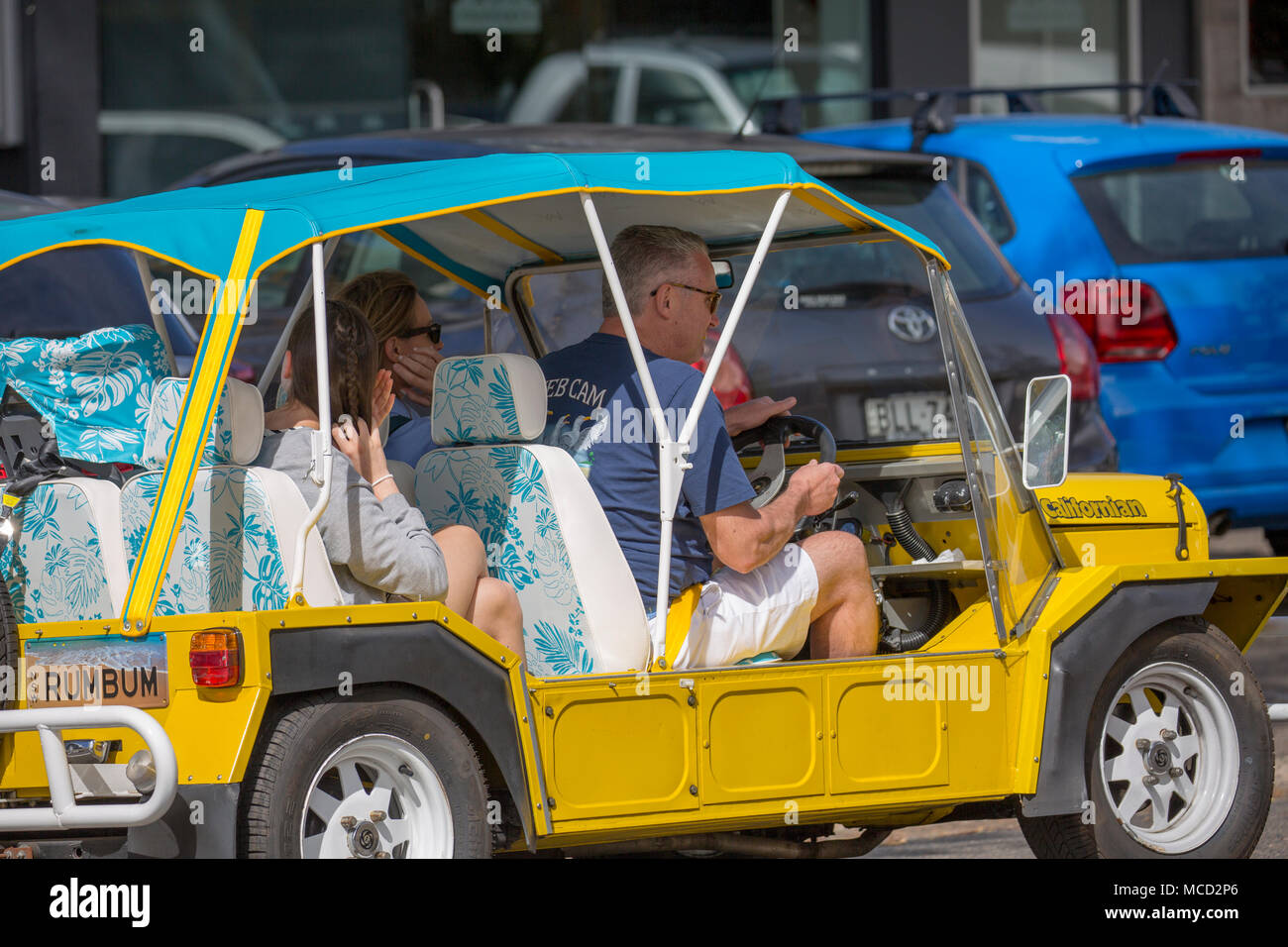 Yellow Mini Moke car vehicle in Sydney Australia carrying a family ...