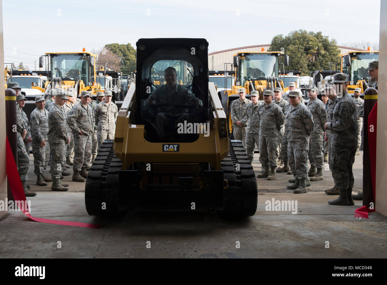 Col. John Winkler, 374th Mission Support Group commander, maneuvers the ...