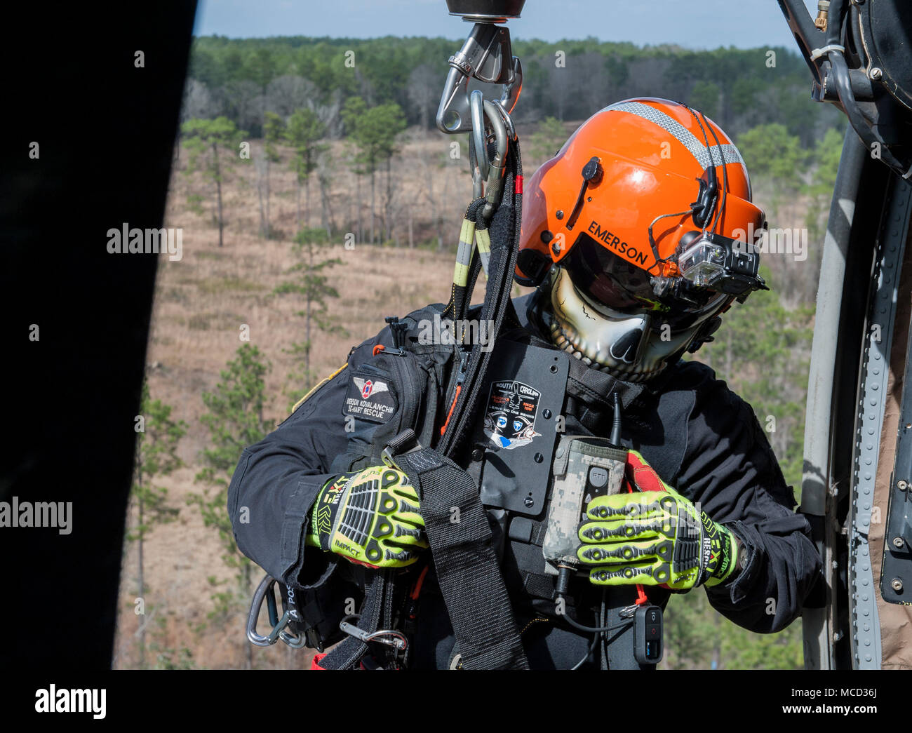 Emerson Kovalanchik, S.C. Helicopter Aquatic Rescue Team, exits a UH-60 ...