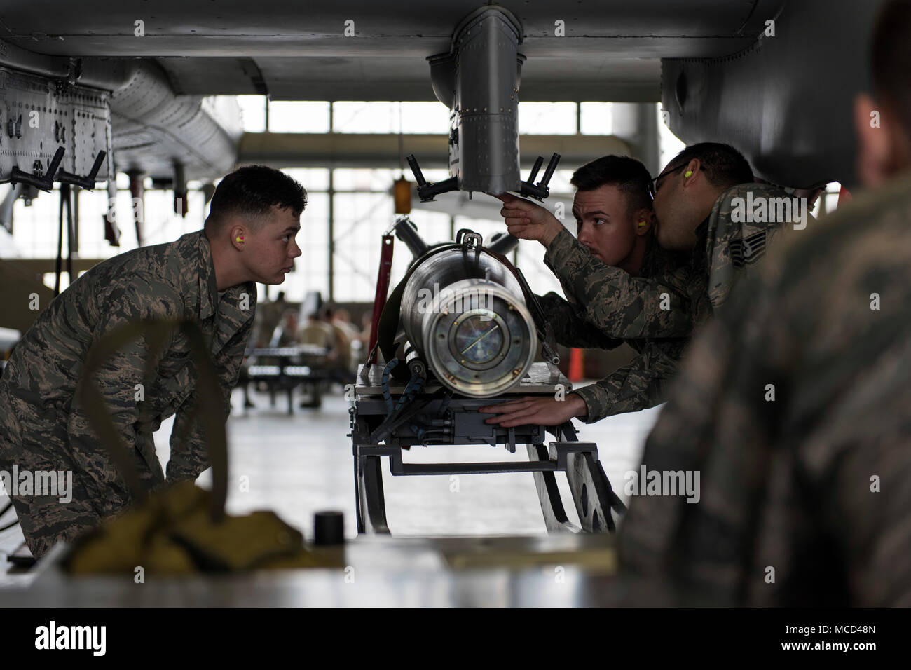 Tech Sgt. Miguel Garza, 363rd Training Squadron armament instructor, shows Airman 1st Class ...