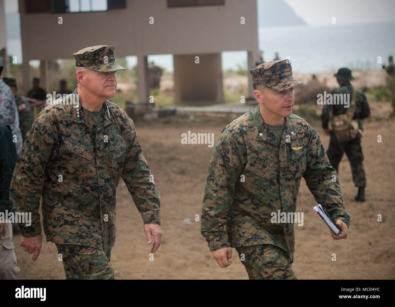 Commandant of the U.S. Marine Corps Gen. Robert B. Neller (left), walks ...