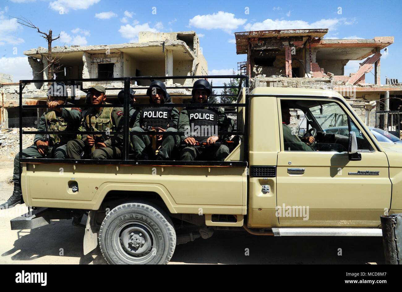 Damascus, Syria. 15th Apr, 2018. Syrian policemen are seen in Douma ...