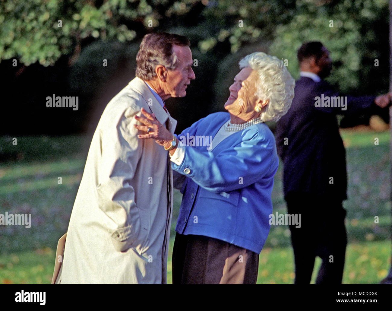 United States President George H.W. Bush hugs first lady Barbara Bush ...
