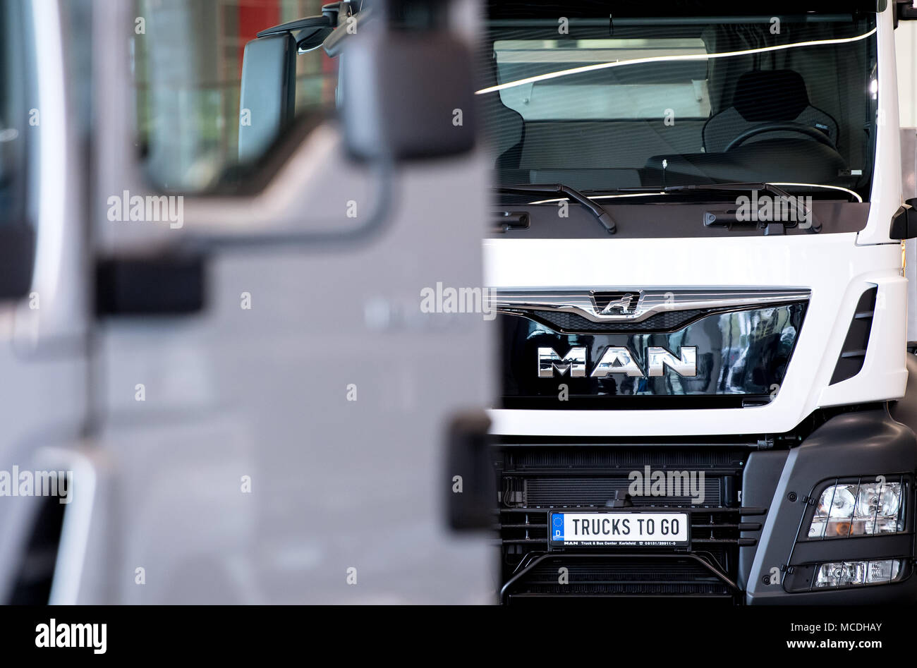 16 April 2018, Germany, Munich: Two MAN trucks at the MAN Forum ...