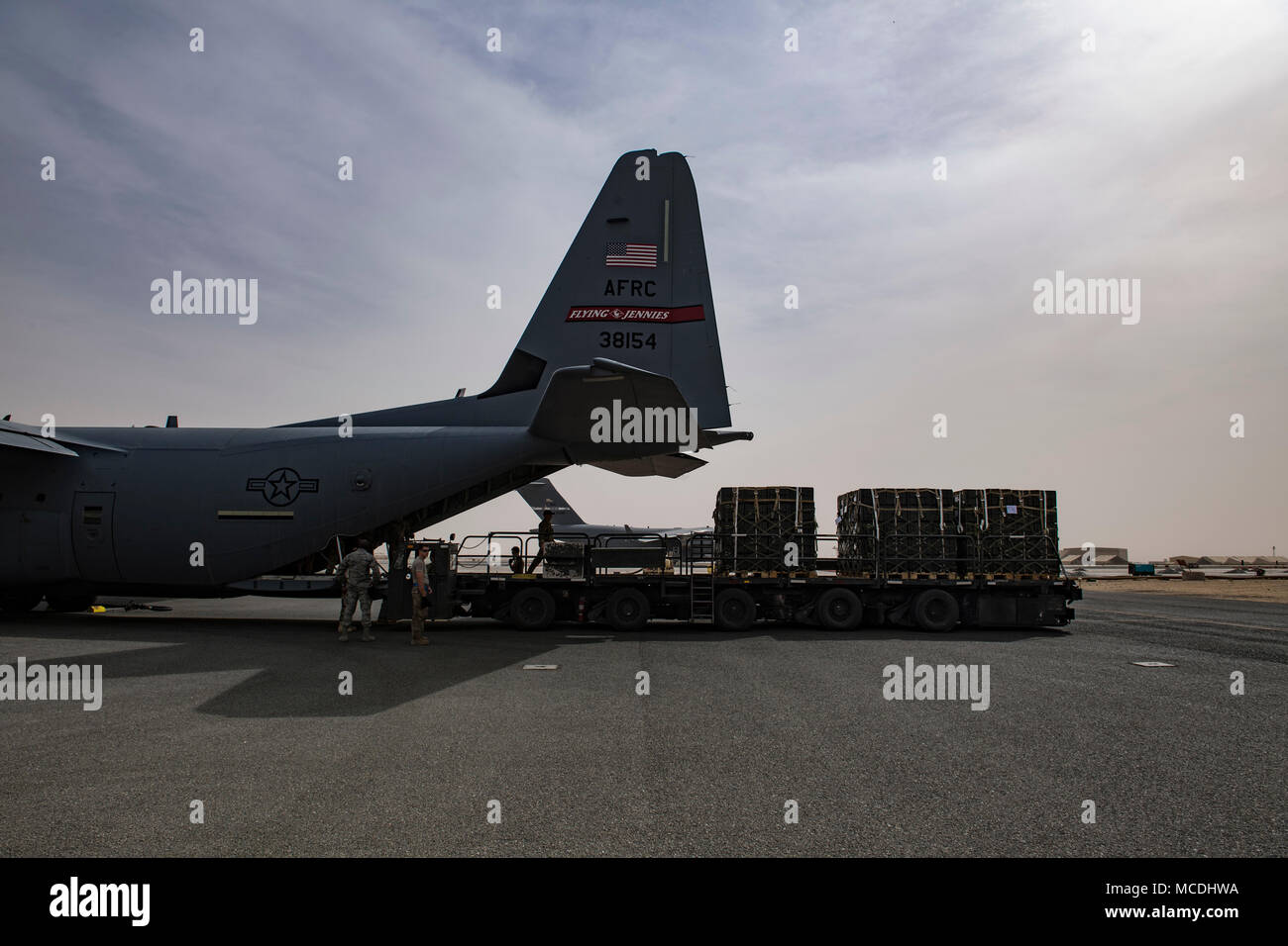U.S. Air Force C-130 Hercules air transportation team members load ...