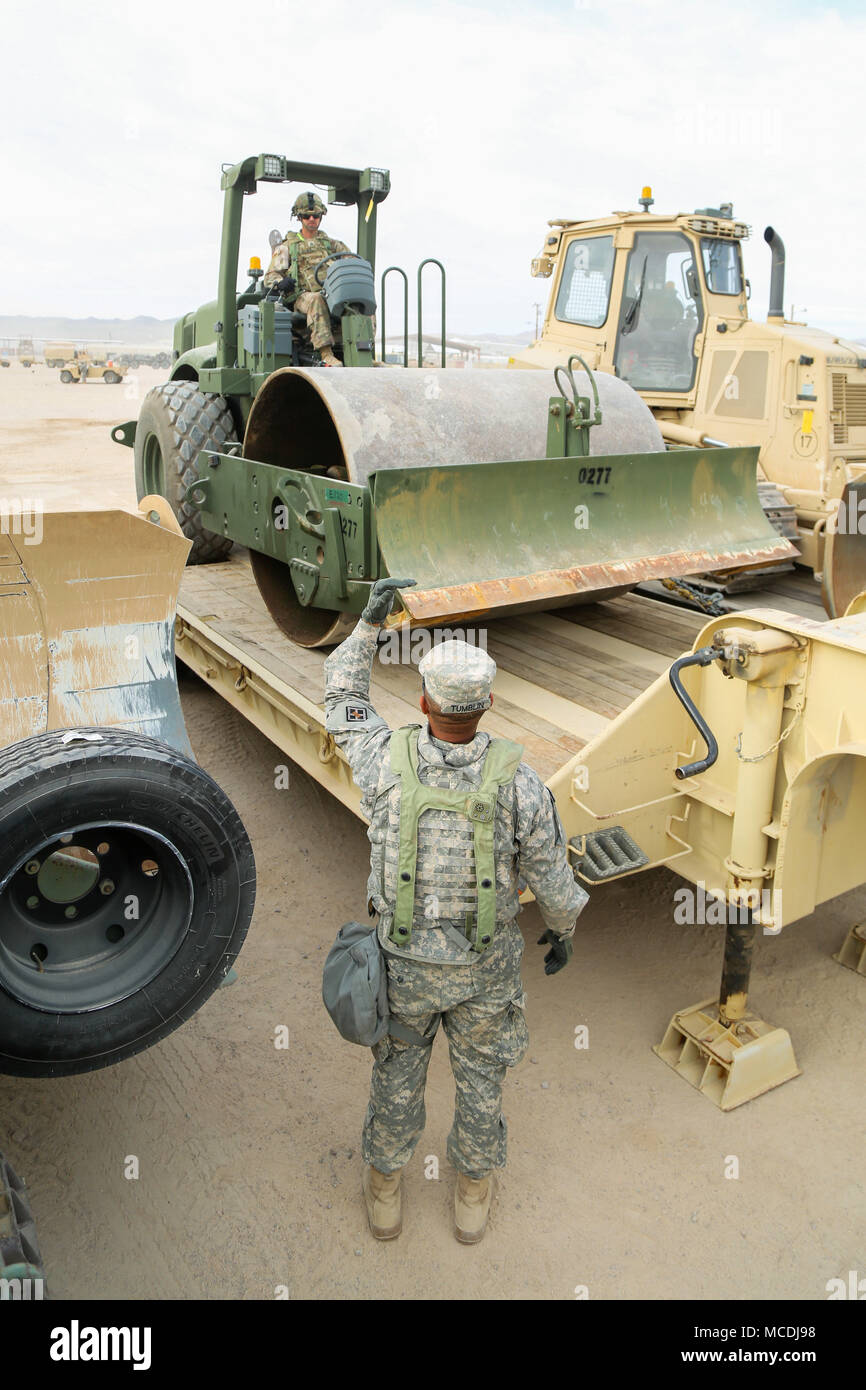 U.S. Army Soldiers assigned to 3rd Cavalry Regiment load a 200kW Heavy ...