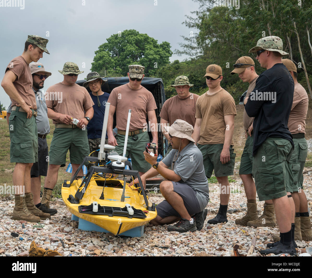 Vitad Pradith, a technical expert for Teledyne Marine, shows U.S. Navy ...