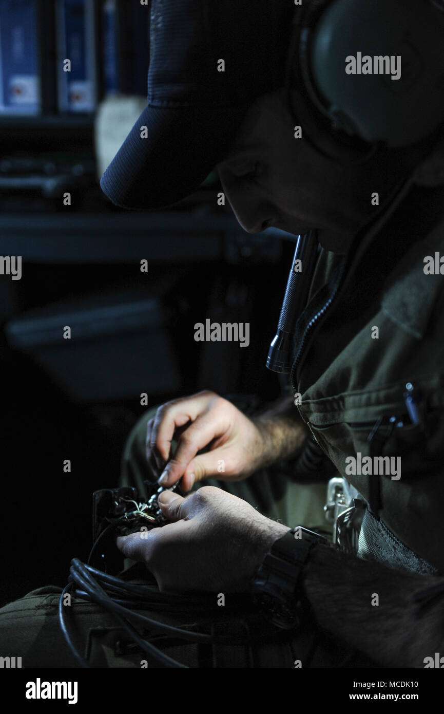 A Royal Canadian Air Force 436th Transport Squadron crewmember repairs ...