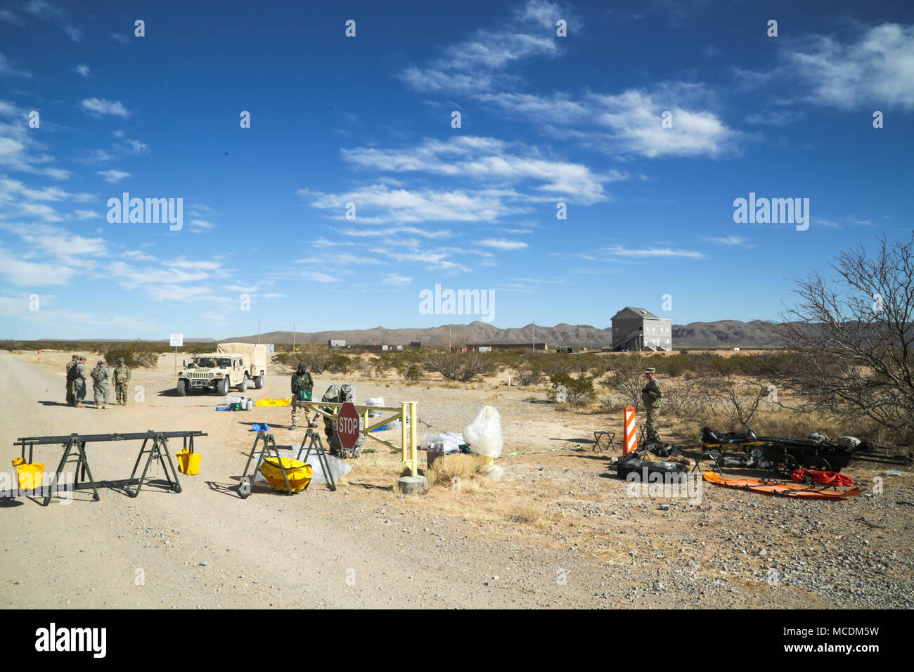 United States Soldiers, assigned to the 48th Chemical Brigade, obseve a ...