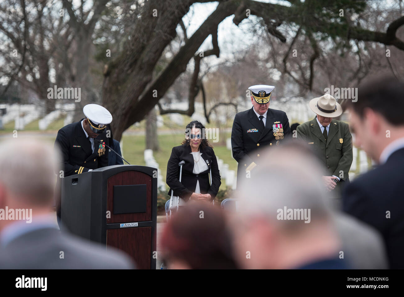 U.S. Navy Chaplain (Lt.) Andrew Francis (left) gives an invocation ...