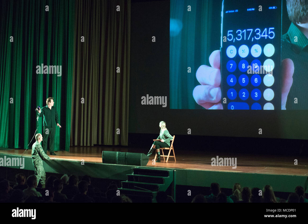 Magician and Illusionist Mike Super performs a trick for the crowd with ...