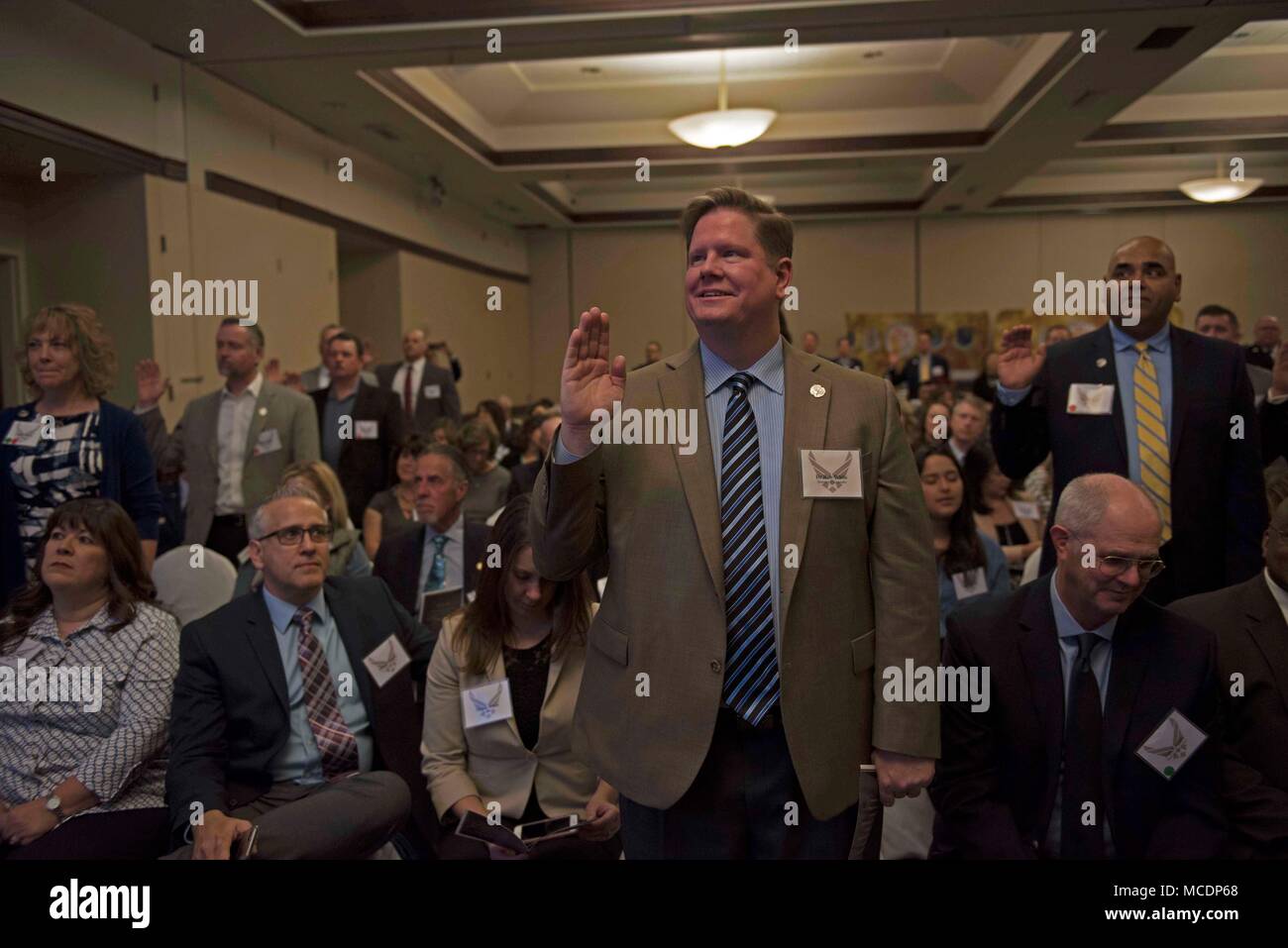 Incoming Honorary Commanders take the honorary commander’s oath during ...