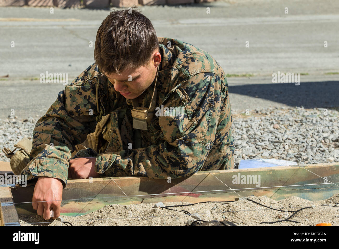 U.S. Navy HN Robert Johnson, an M249 light machine gun gunner with ...