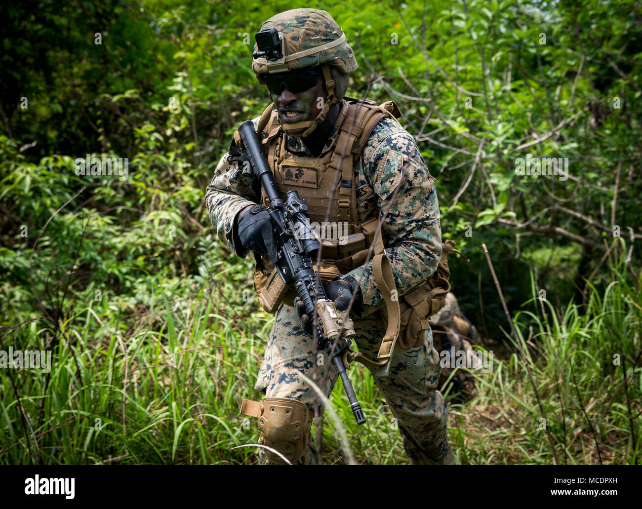 U.S. Marine Sgt. Justice Appiah runs towards the objective during ...