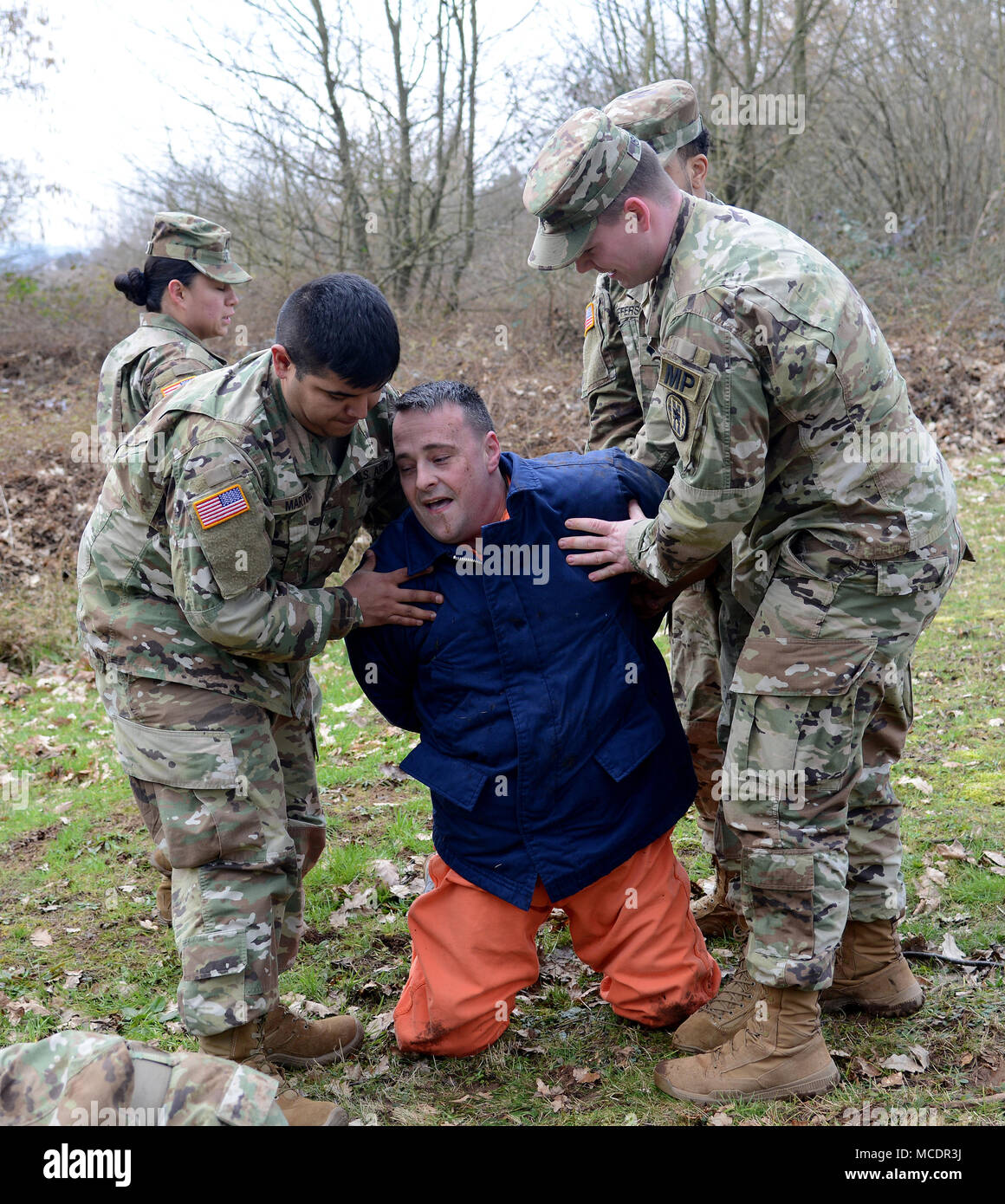 Sgt. Jacob Israel and Spc. Matthew Martinez, restrain Staff Sgt. Joseph ...