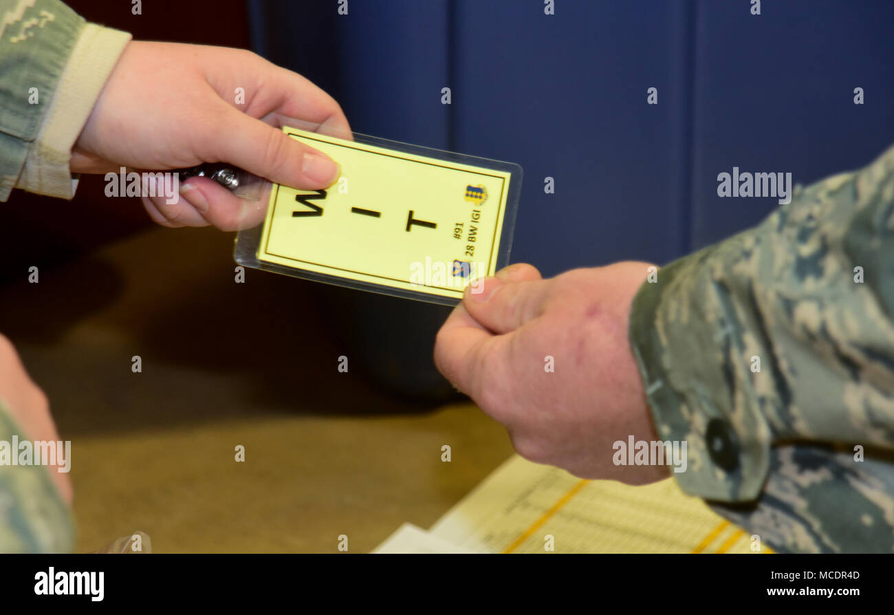 Wing Inspection Team members collect their badges before an active ...