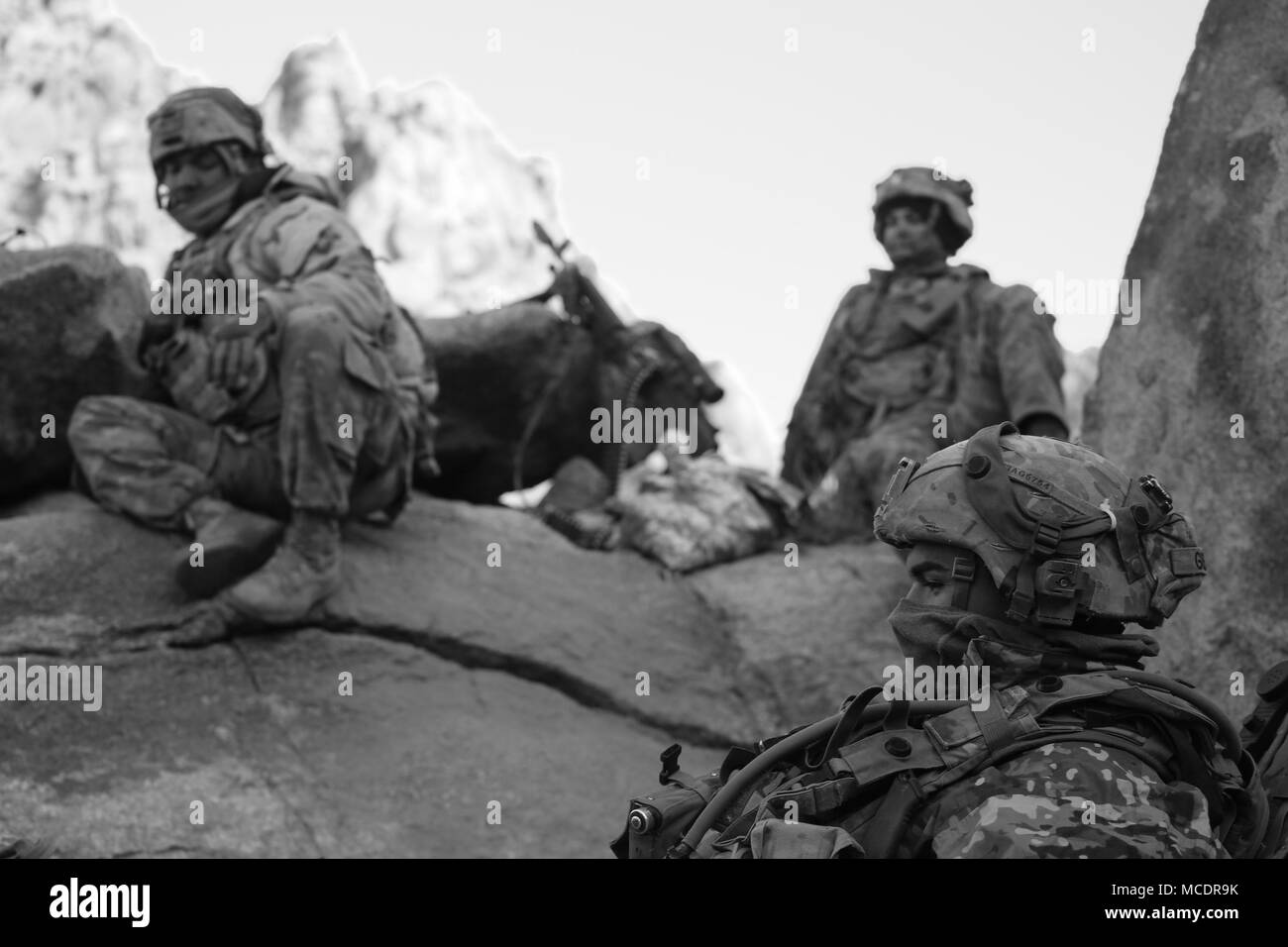 U.S. Soldiers assigned to 4th Squadron, 3rd Cavalry Regiment, sit in a ...