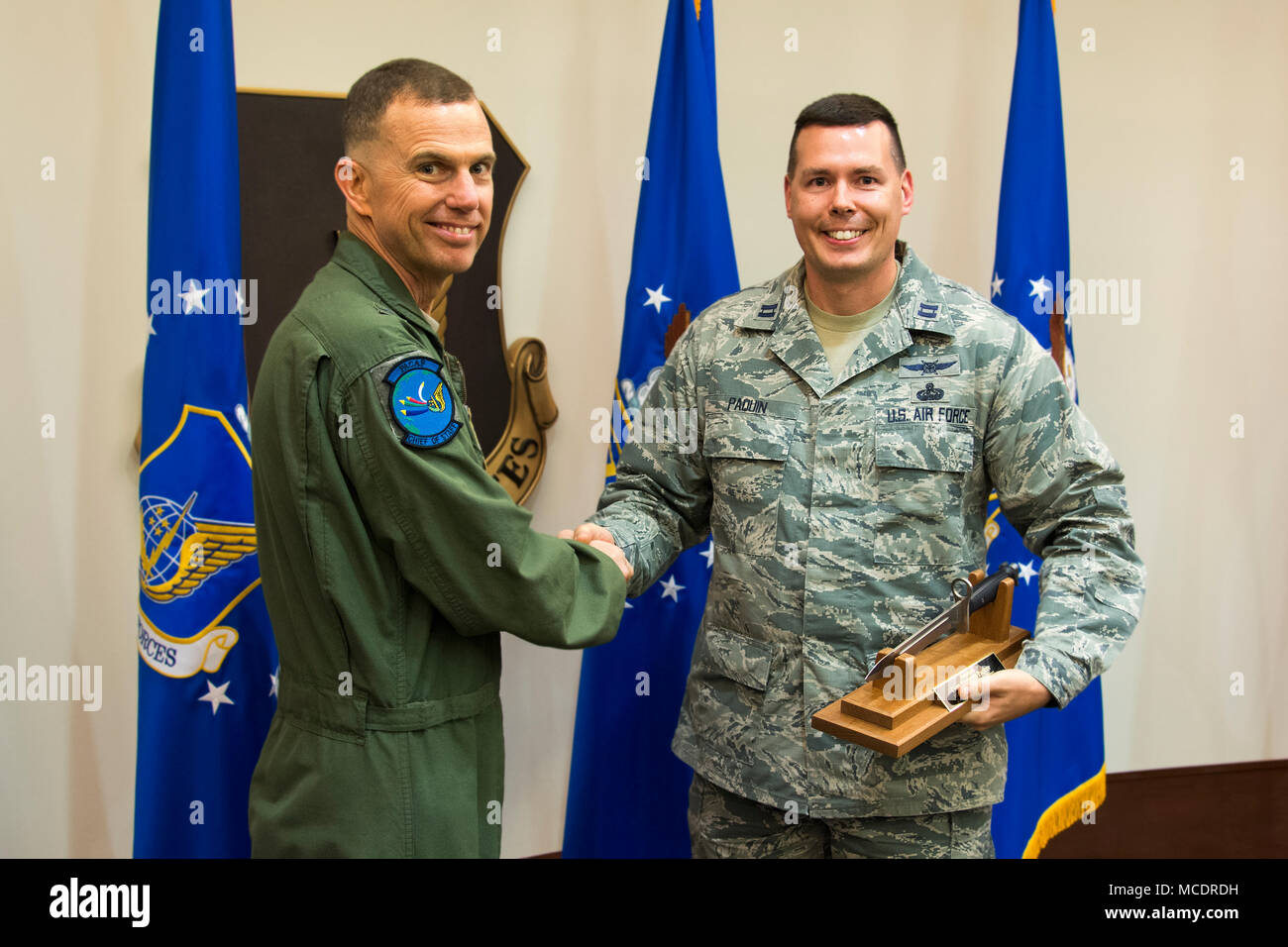 Capt. Kenneth Paquinis is presented with the 2017 Company Grade Officer ...