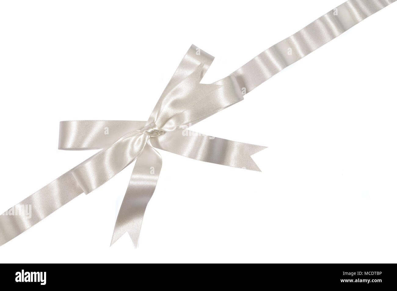 Hand tied ribbon and bow in ivory white or silver satin isolated ...
