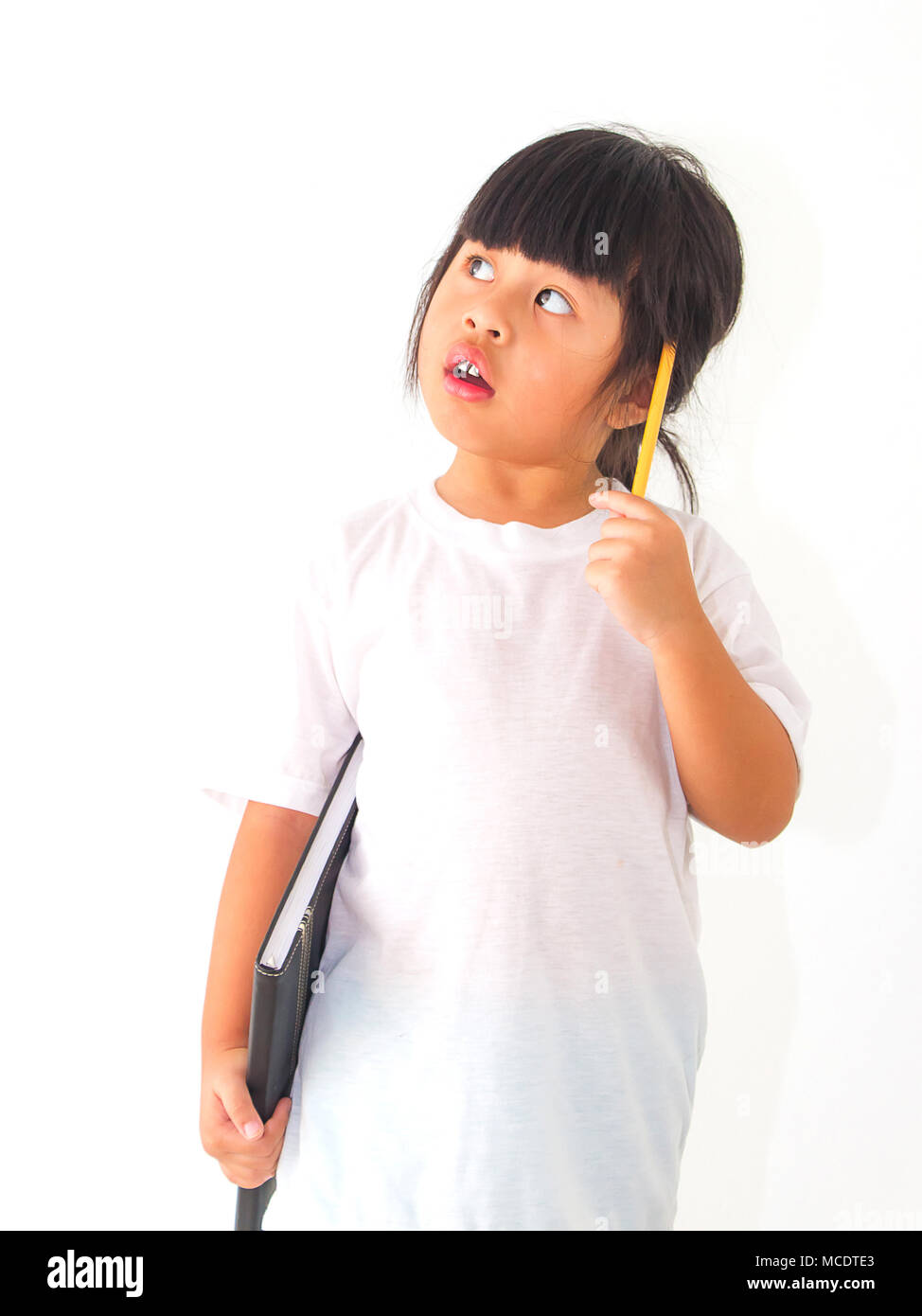 Girl thinking with pencil hi-res stock photography and images - Alamy