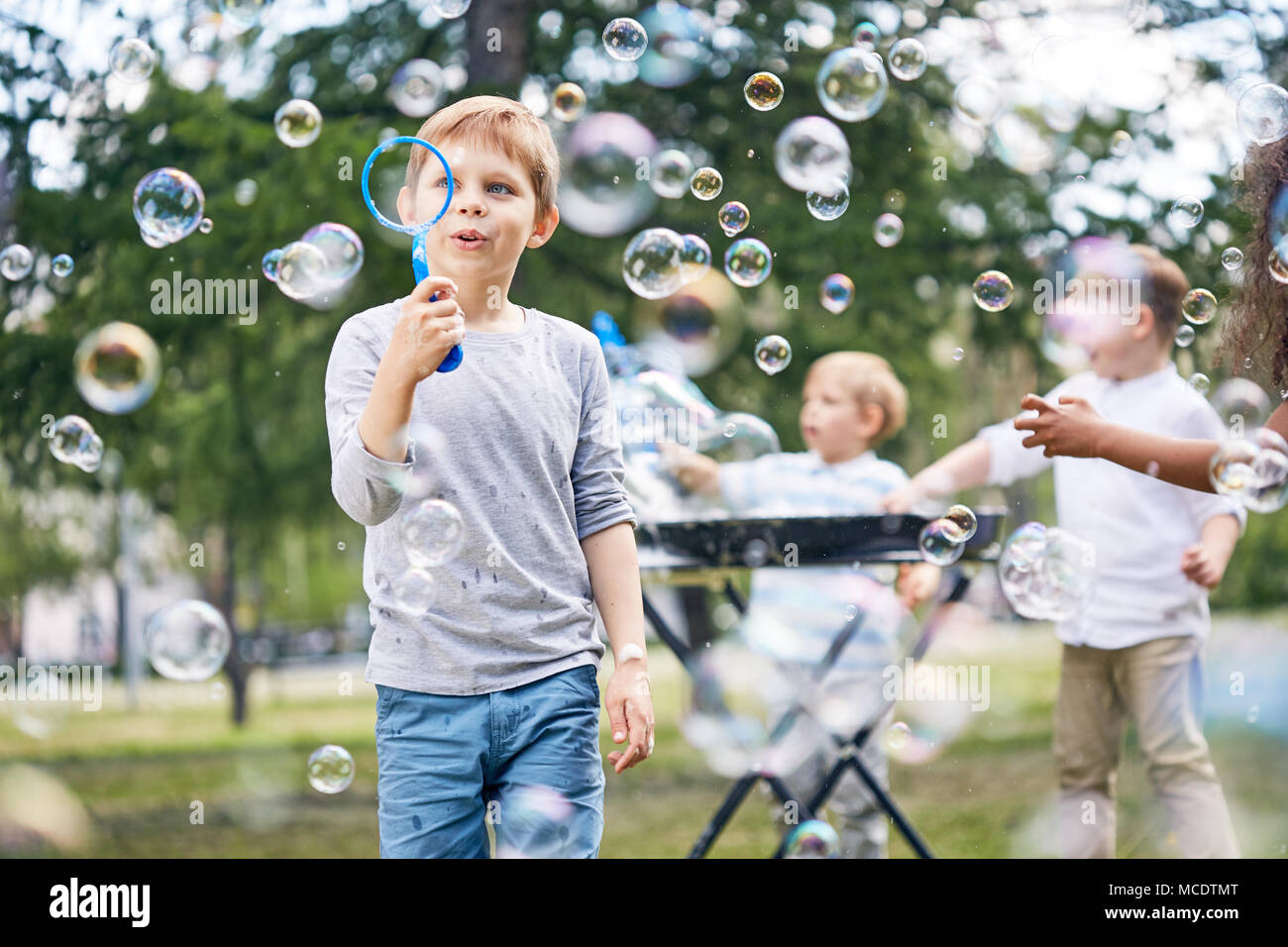 Little Boys Making Soap Bubbles Stock Photo - Alamy