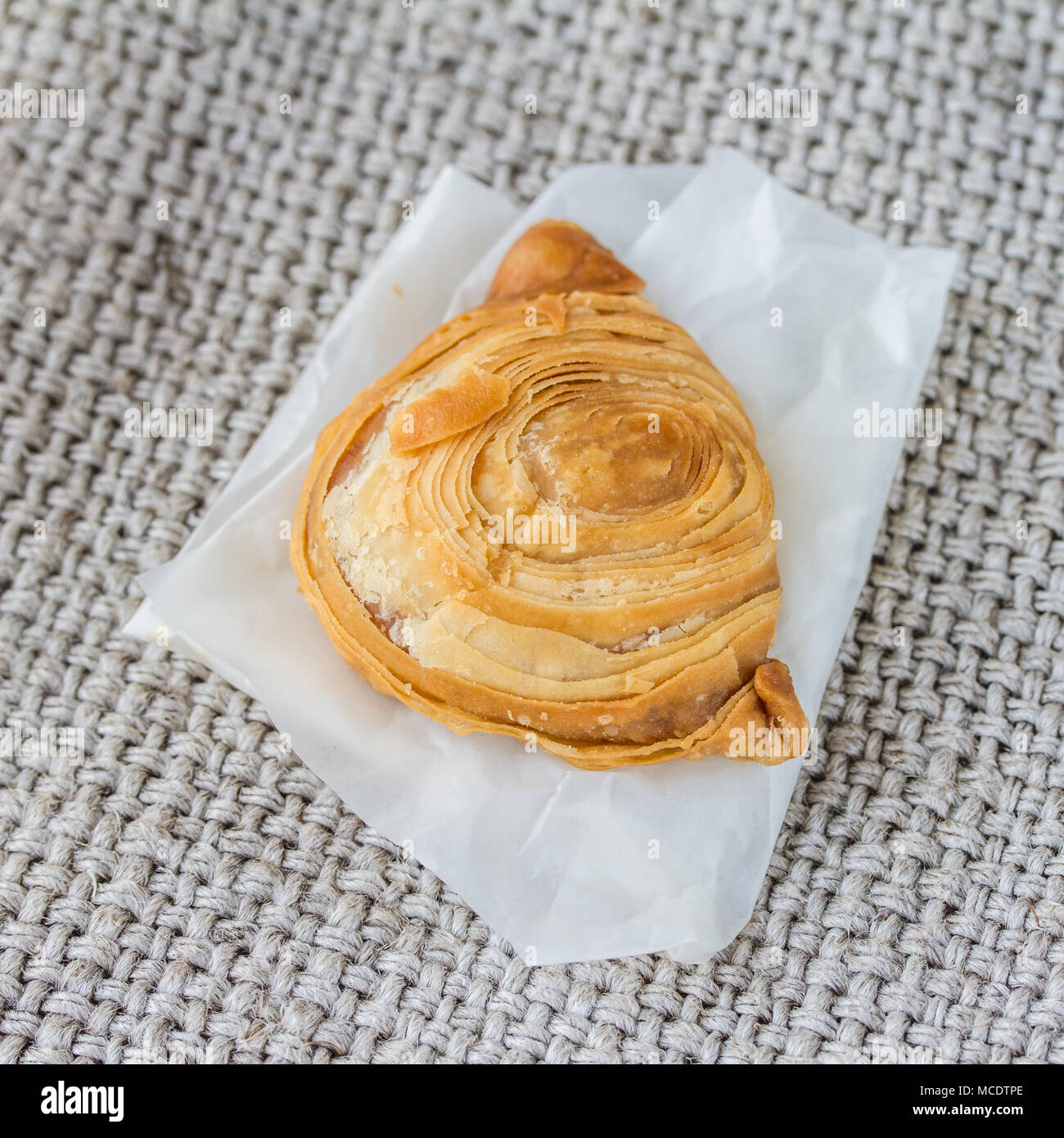 Image of curry puff in white paper on sack background Stock Photo - Alamy