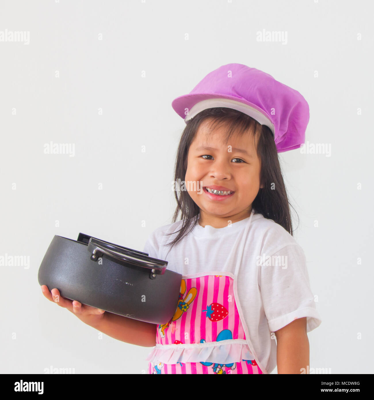 little girl cook holding a pot on white background Stock Photo - Alamy