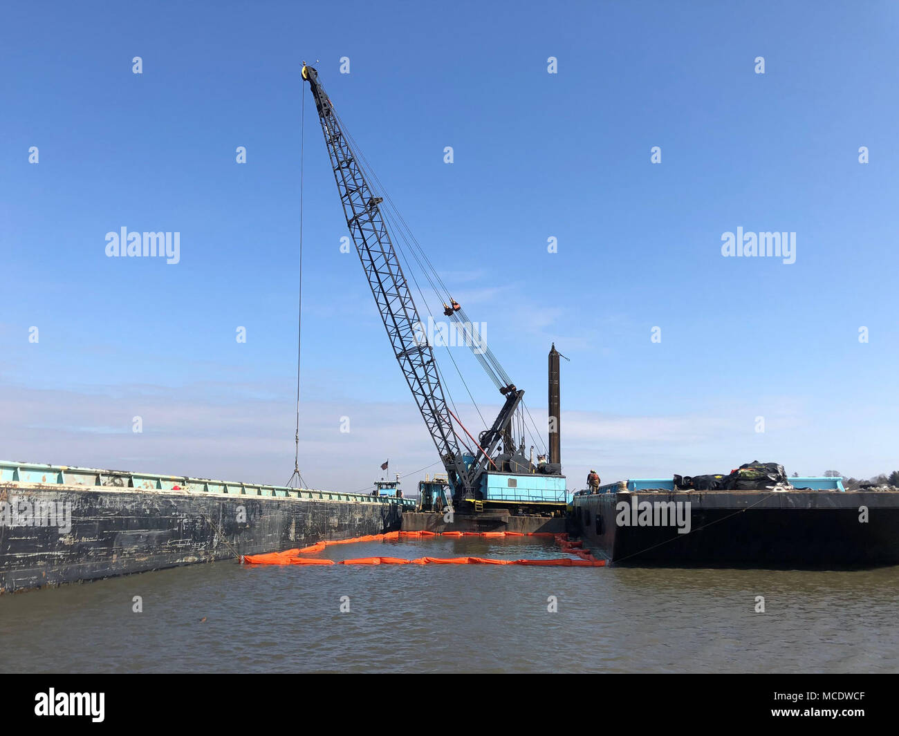 A dredge excavates material from the North Cove Federal Navigation ...
