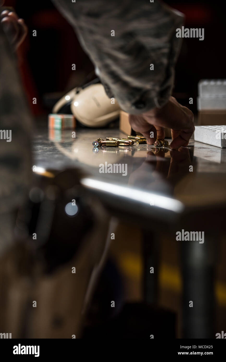 A student pilot from the 71st Flying Training Wing loads a magazine ...