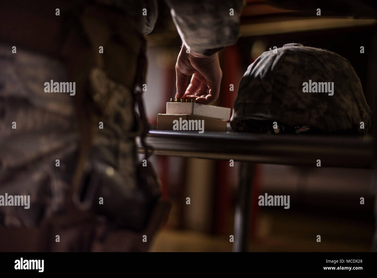 A student pilot from the 71st Flying Training Wing loads a magazine ...