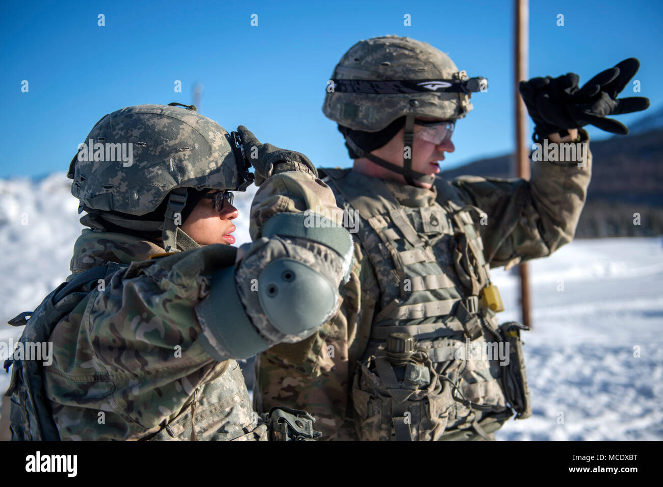 Pfc. Miranda Argueta, left, and Staff Sgt. David Riley, assigned to the ...