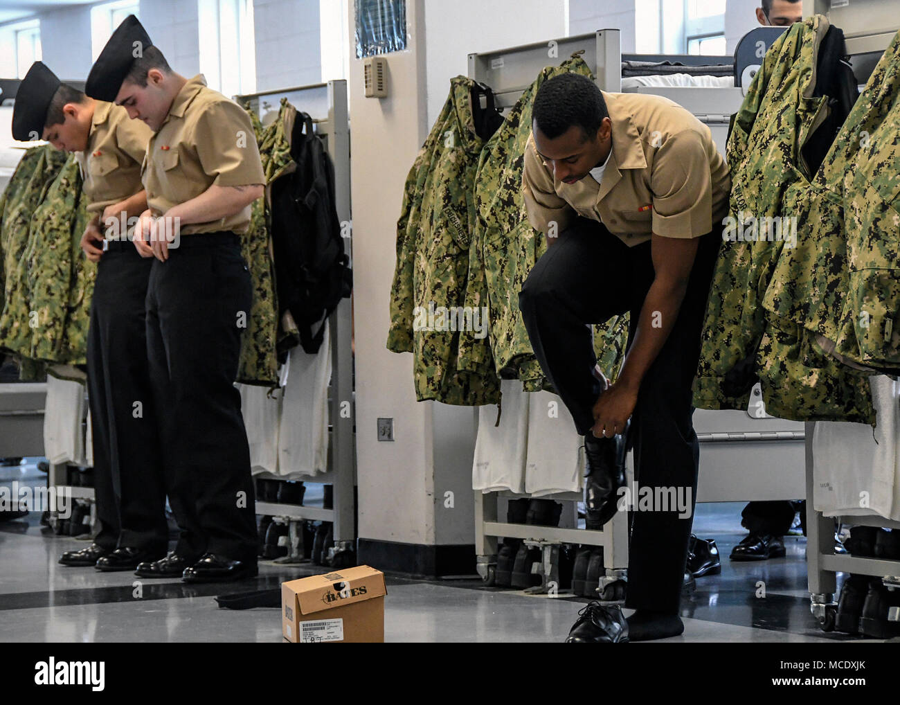180221-N-IY633-006 GREAT LAKES, Ill. (Feb. 21, 2018) Recruits don their ...