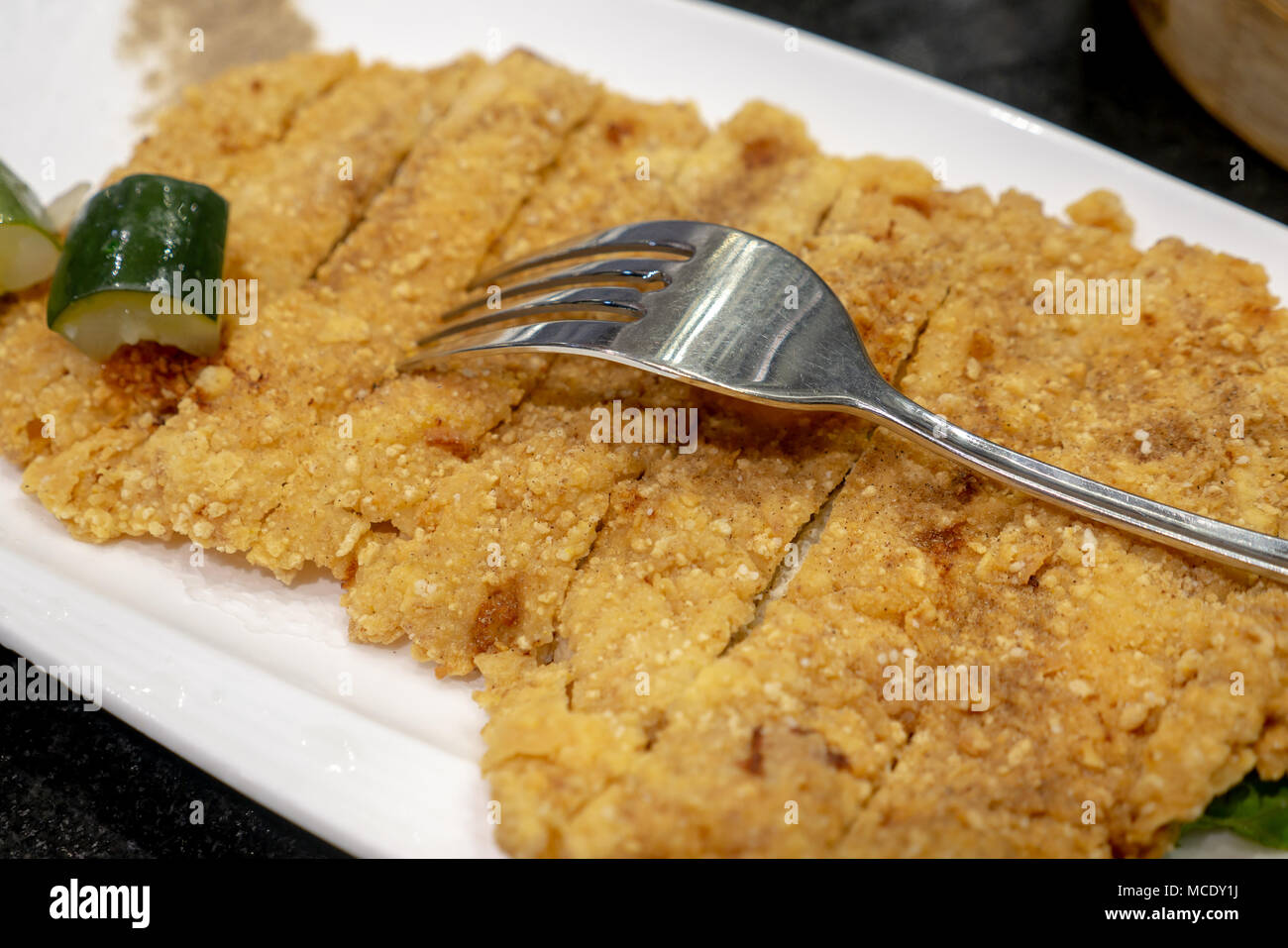 Taiwanese style fried pork chop with spoon Stock Photo - Alamy
