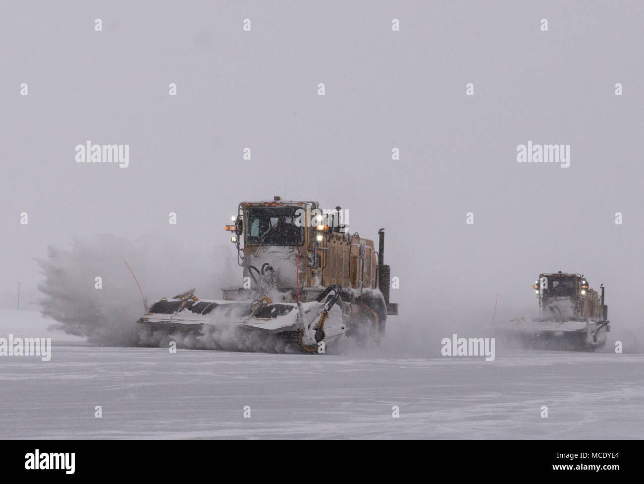 Members of the 773d Civil Engineer Squadron Snow Barn remove snow from ...